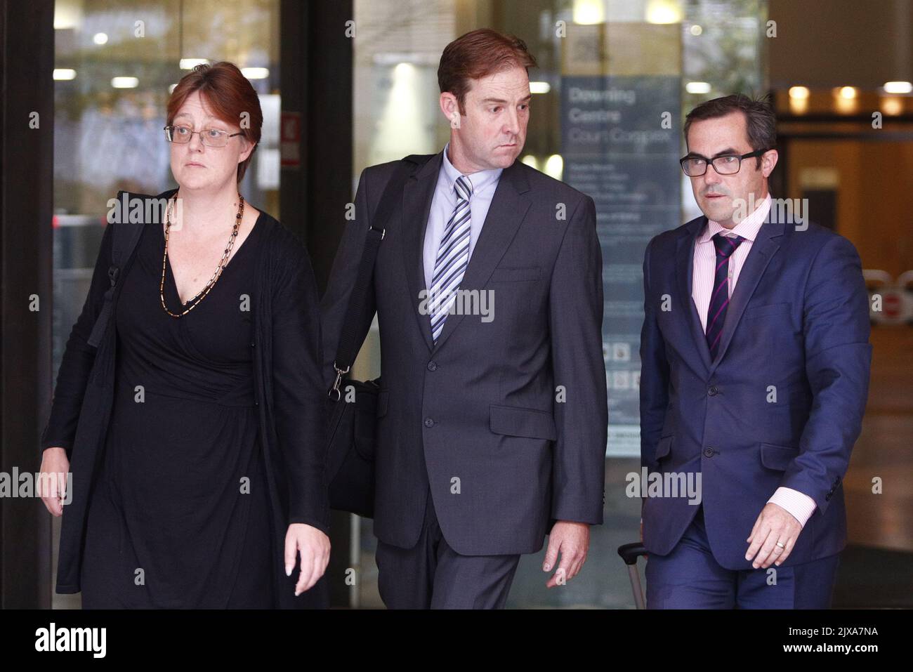 Andrew Dadley (centre) leaves Downing Centre Local Court in Sydney ...