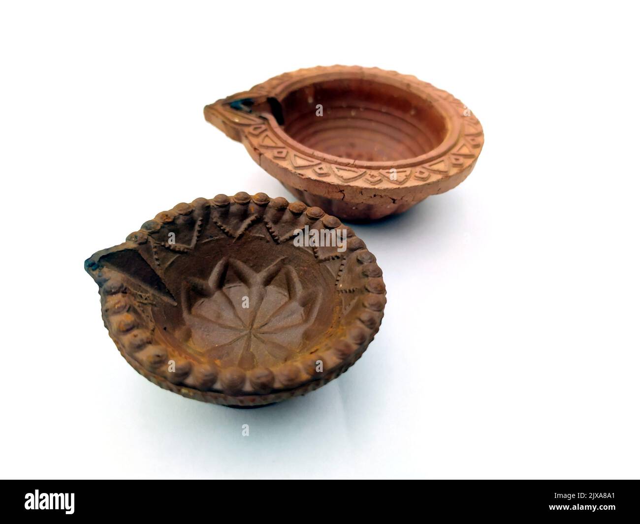 Traditional clay diya lamps lit during diwali celebration Stock Photo ...