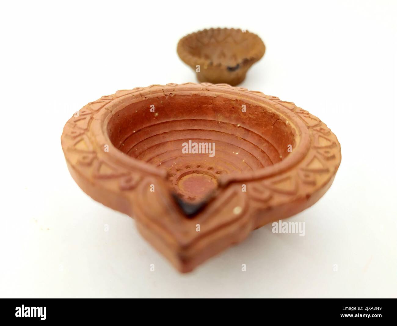 Traditional clay diya lamps lit during diwali celebration Stock Photo ...