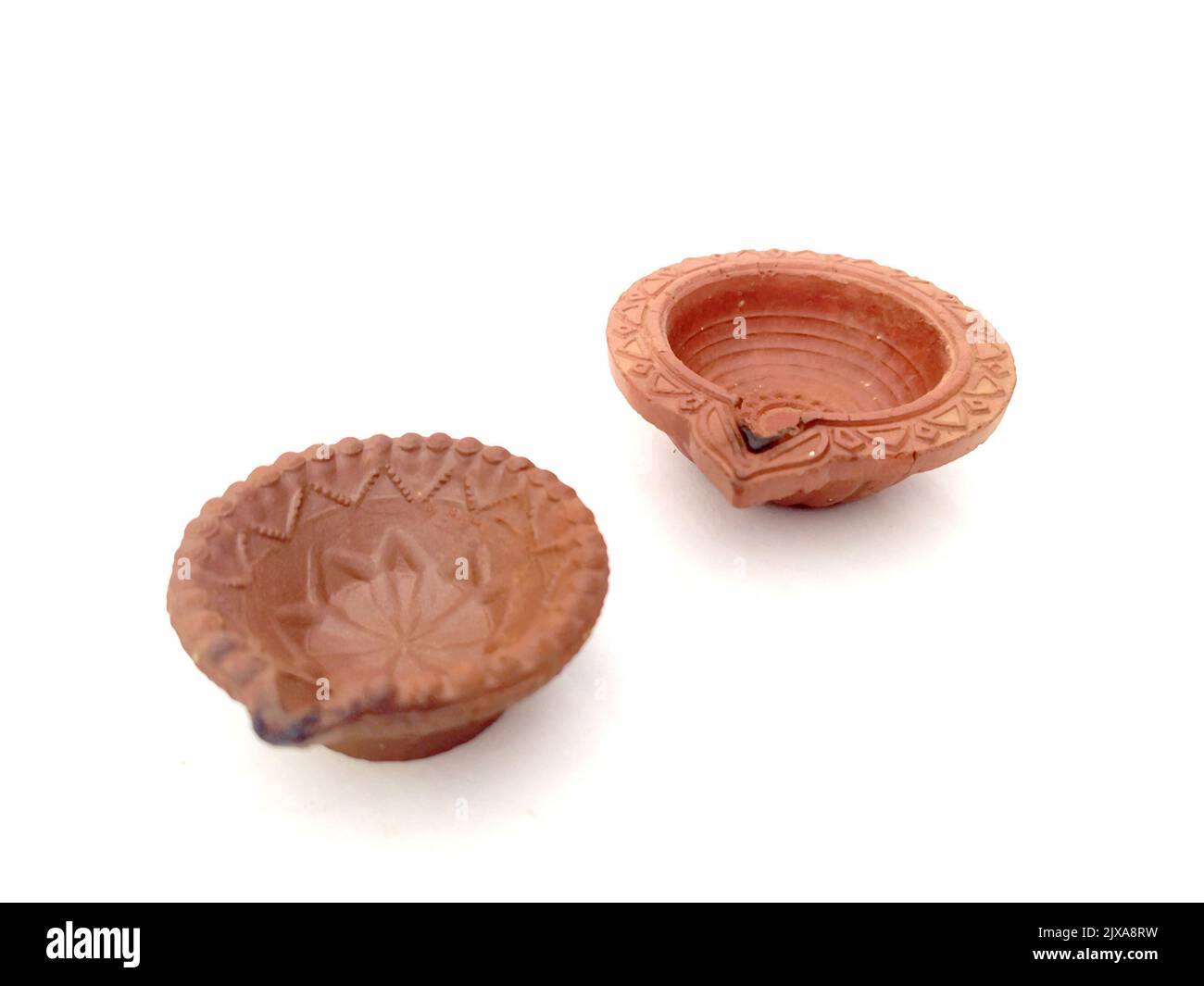 Traditional clay diya lamps lit during diwali celebration Stock Photo ...