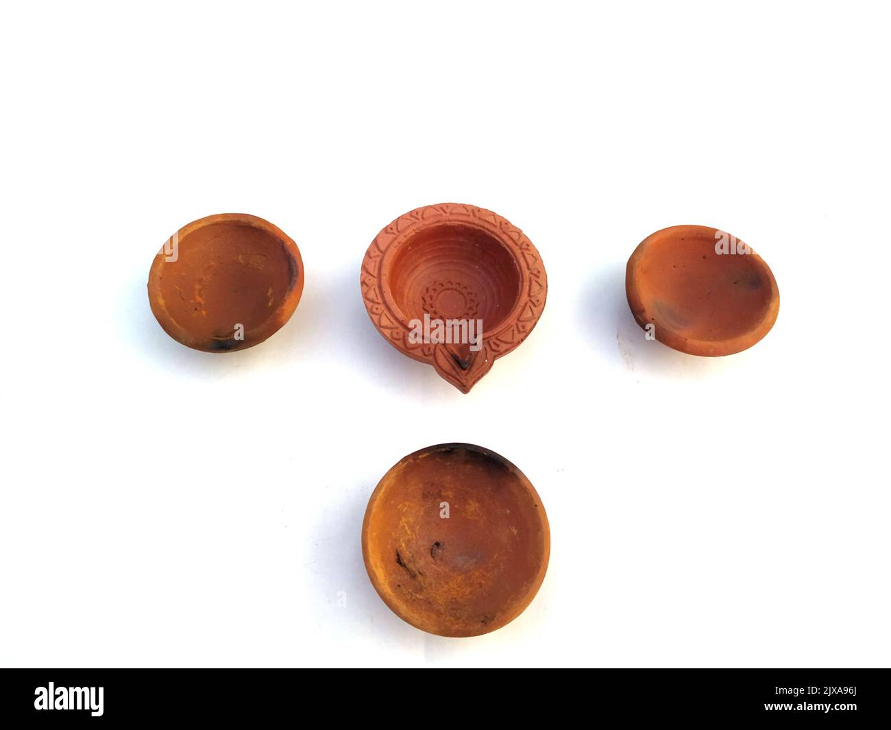 Traditional clay diya lamps lit during diwali celebration Stock Photo ...
