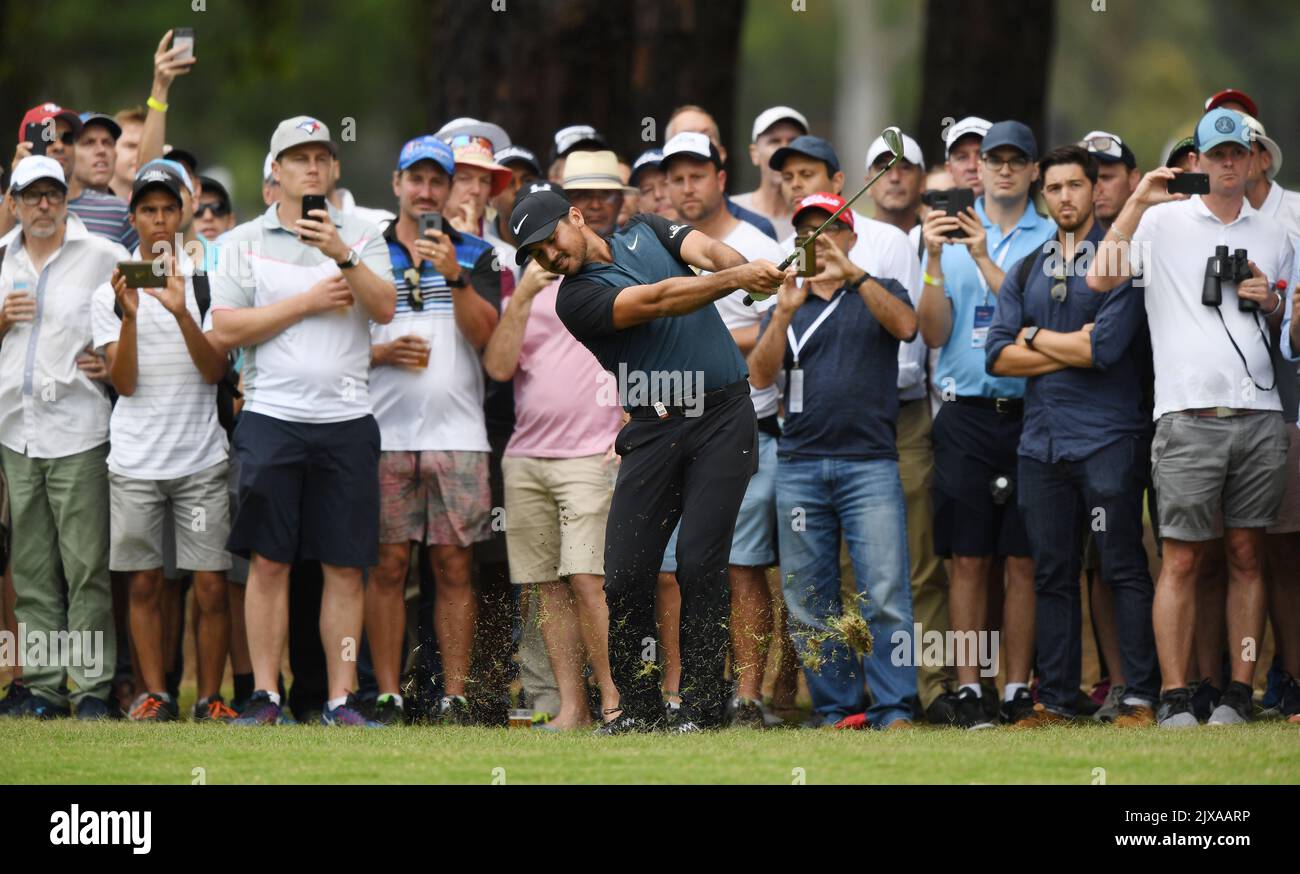 Jason Day of Australia plays his second shot at the sixteenth hole ...