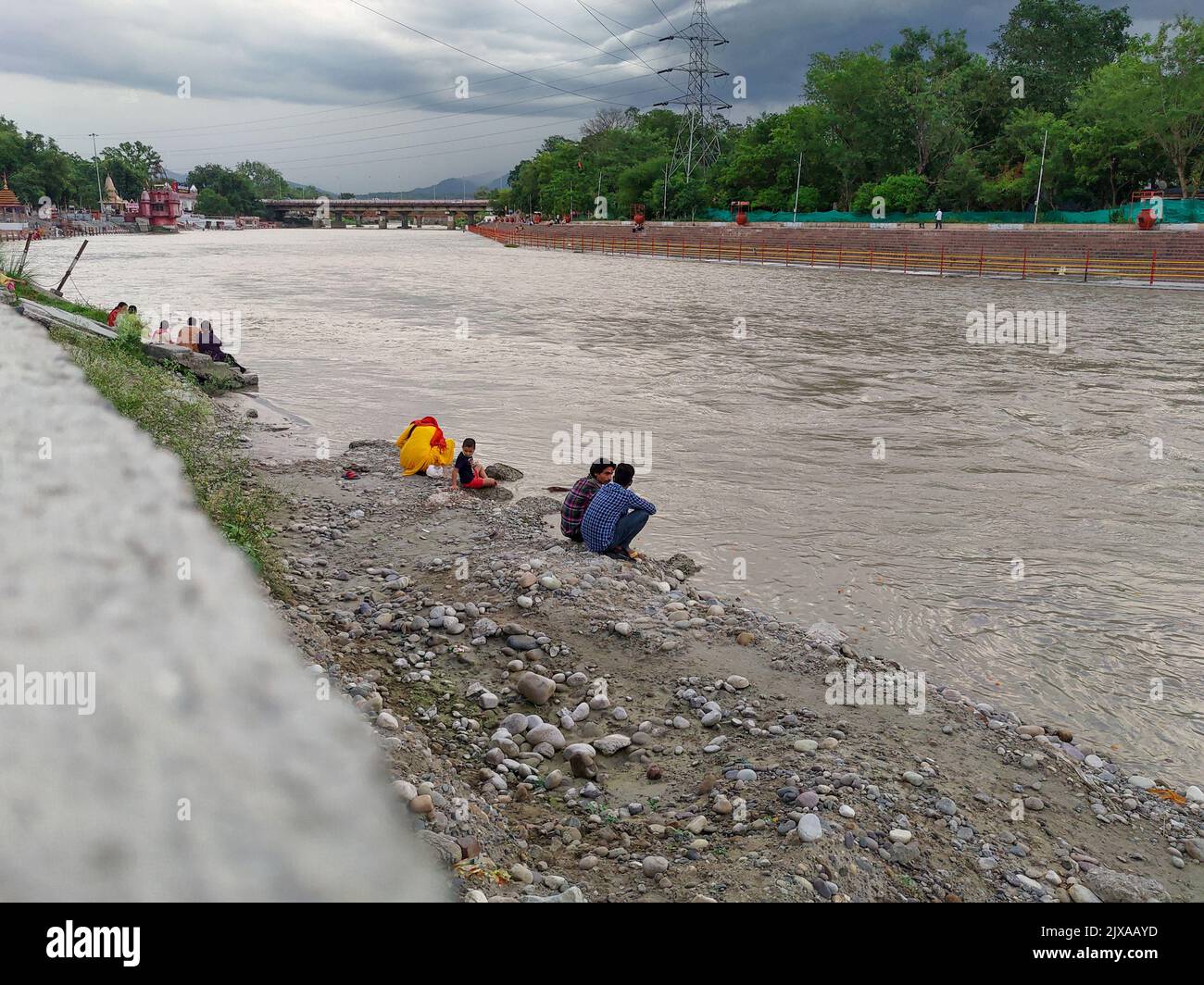 June 17th 2021 Haridwar Uttarakhand India. People sitting on the banks ...