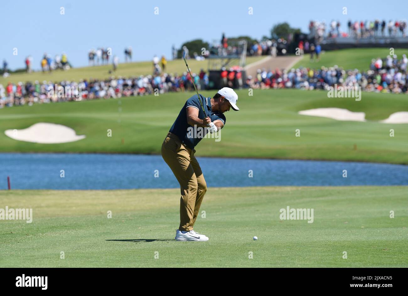 Jason Day of Australia plays his second shot at the nineth hole during ...