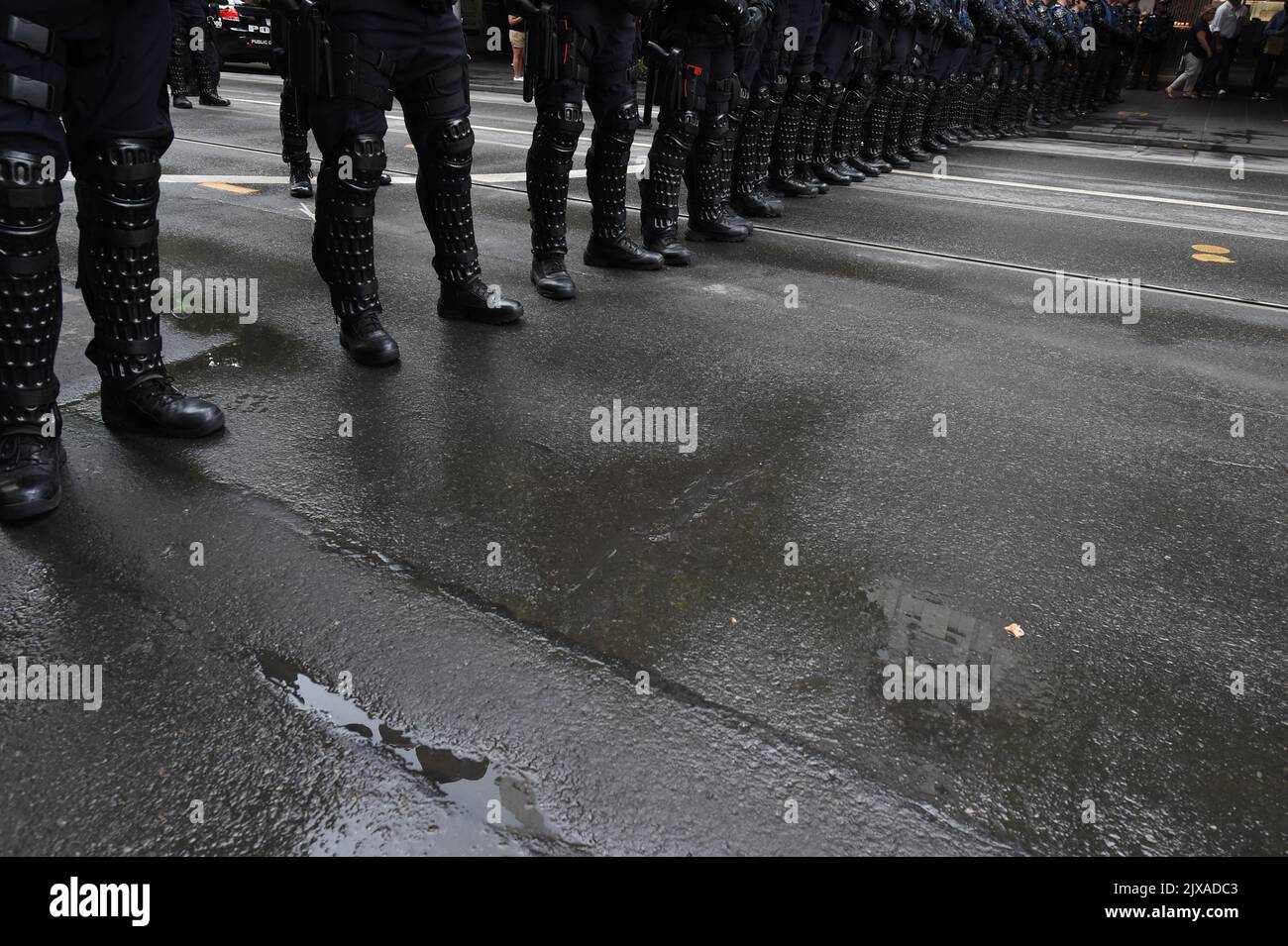Victoria Police officers are seen during a Manus Island protest in ...