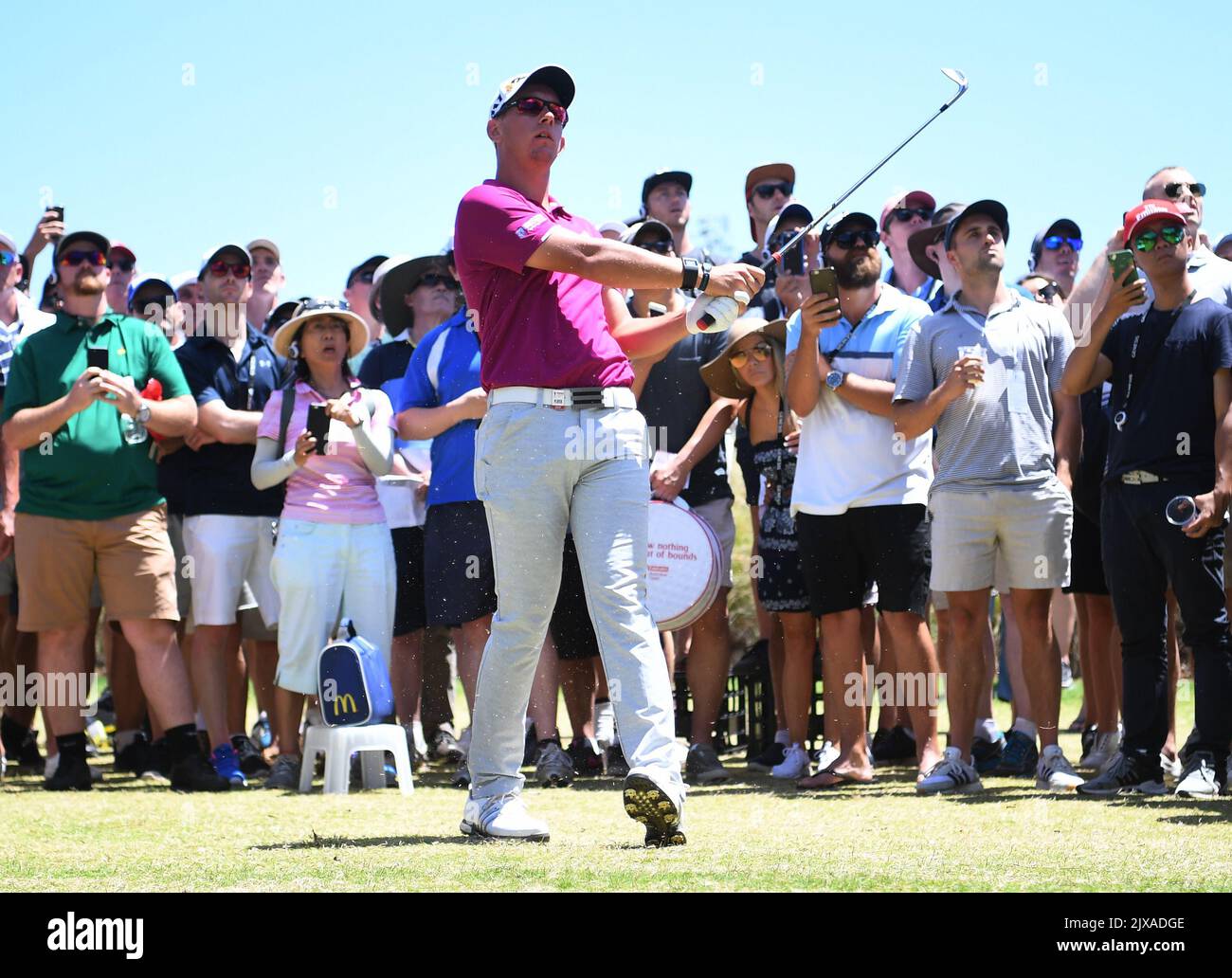 Lucas Herbert of Australia plays his third shot at the fifth hole ...