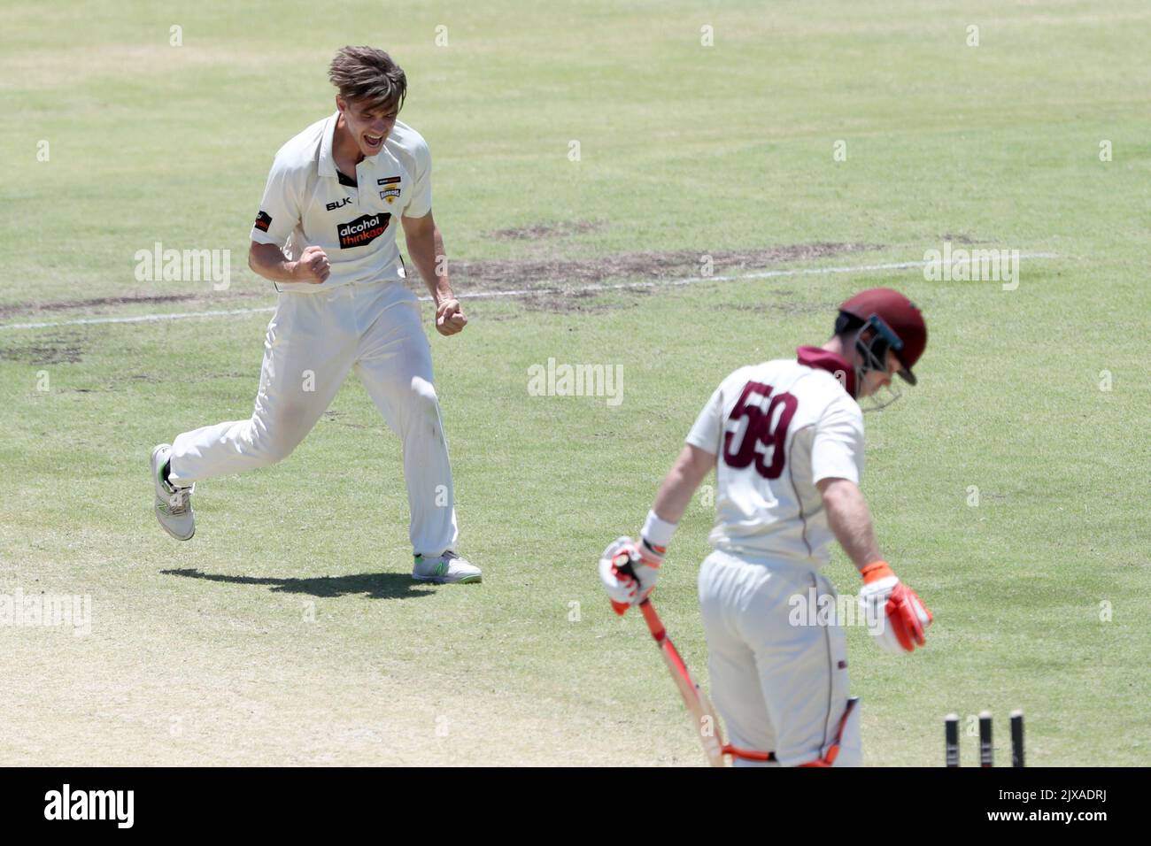Andrew Holder of Western Australia celebrates bowling James Peirson of ...