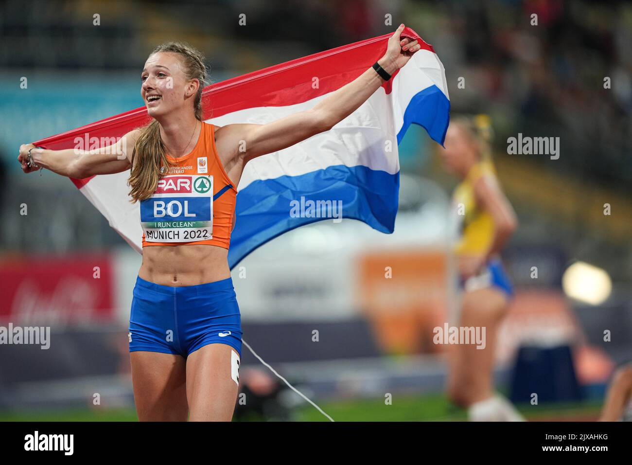 Femke Bol with her country's flag as the winner of the 400 meters ...