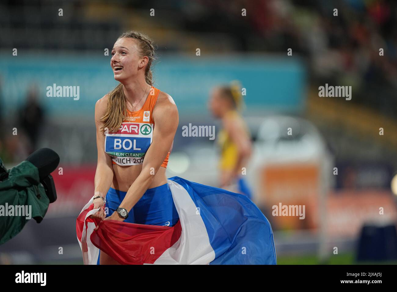 Femke Bol with her country's flag as the winner of the 400 meters ...