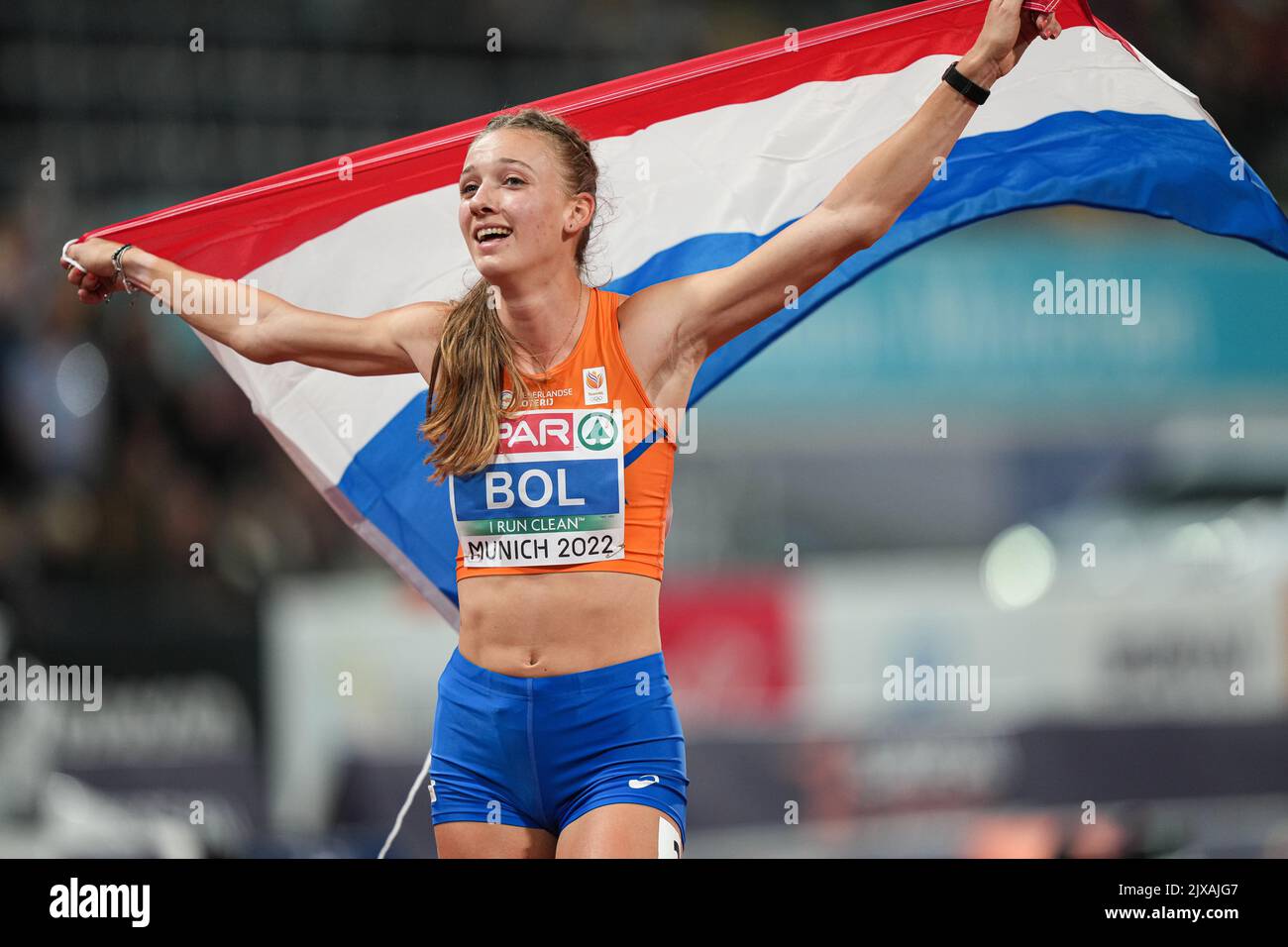 Femke Bol with her country's flag as the winner of the 400 meters ...