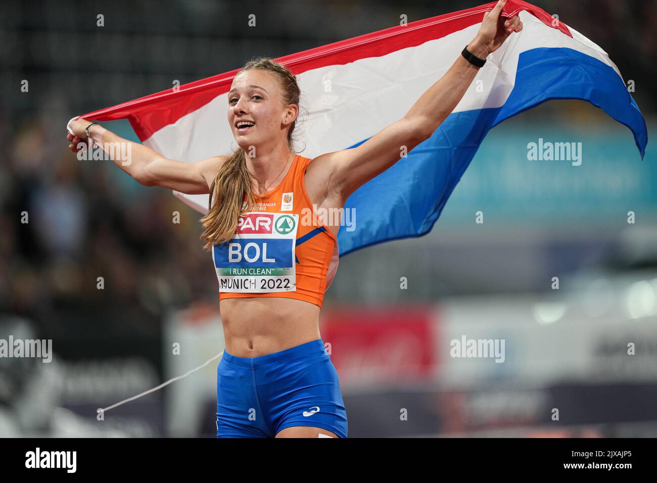 Femke Bol with her country's flag as the winner of the 400 meters ...