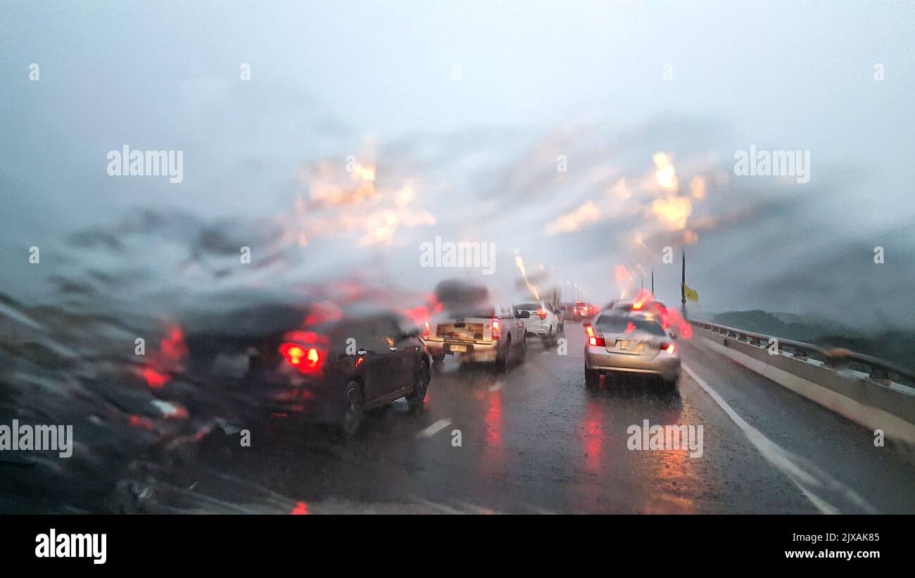 Inside the car. Closeup rain water drops. car windshield view during ...