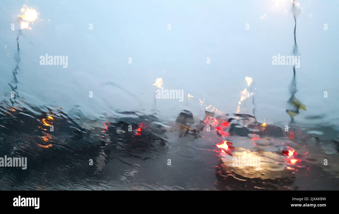Inside the car. Closeup rain water drops. car windshield view during ...