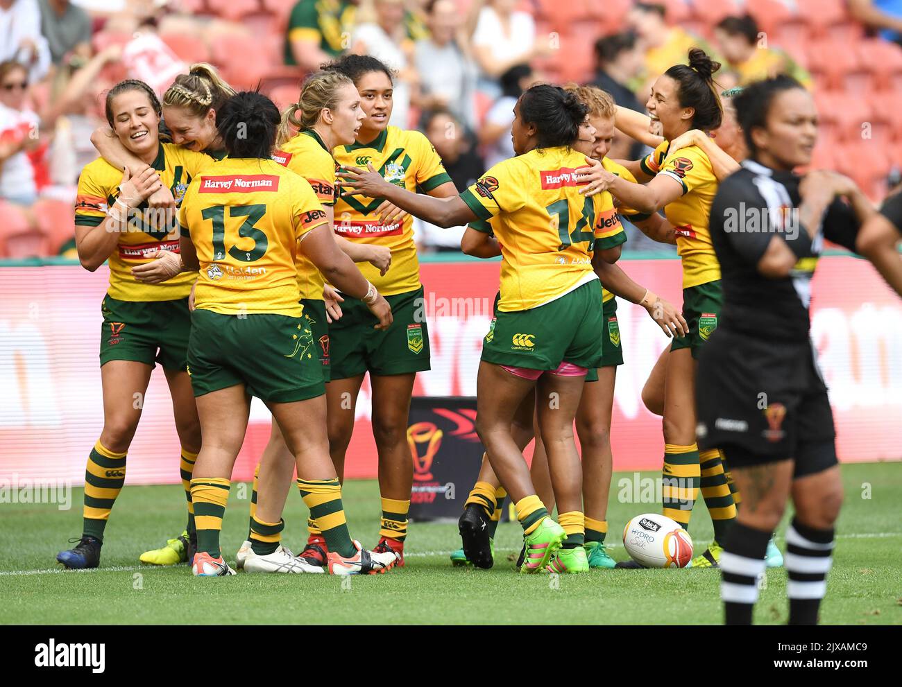 Jillaroos players celebrate scoring a try during the Women's Rugby League World Cup final match ...