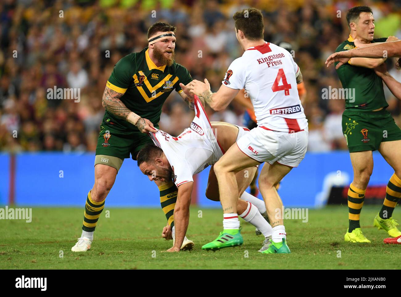 Josh Mcguire of Australia (left) holds Luke Gale of England during an ...