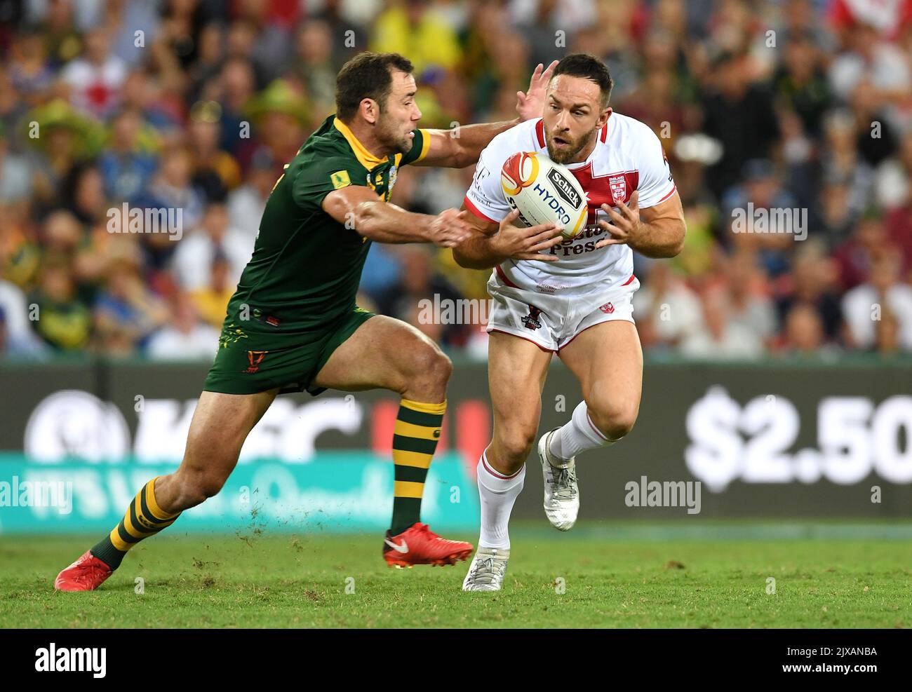 Australian Captain Cameron Smith (left) tackles Luke Gale of England ...