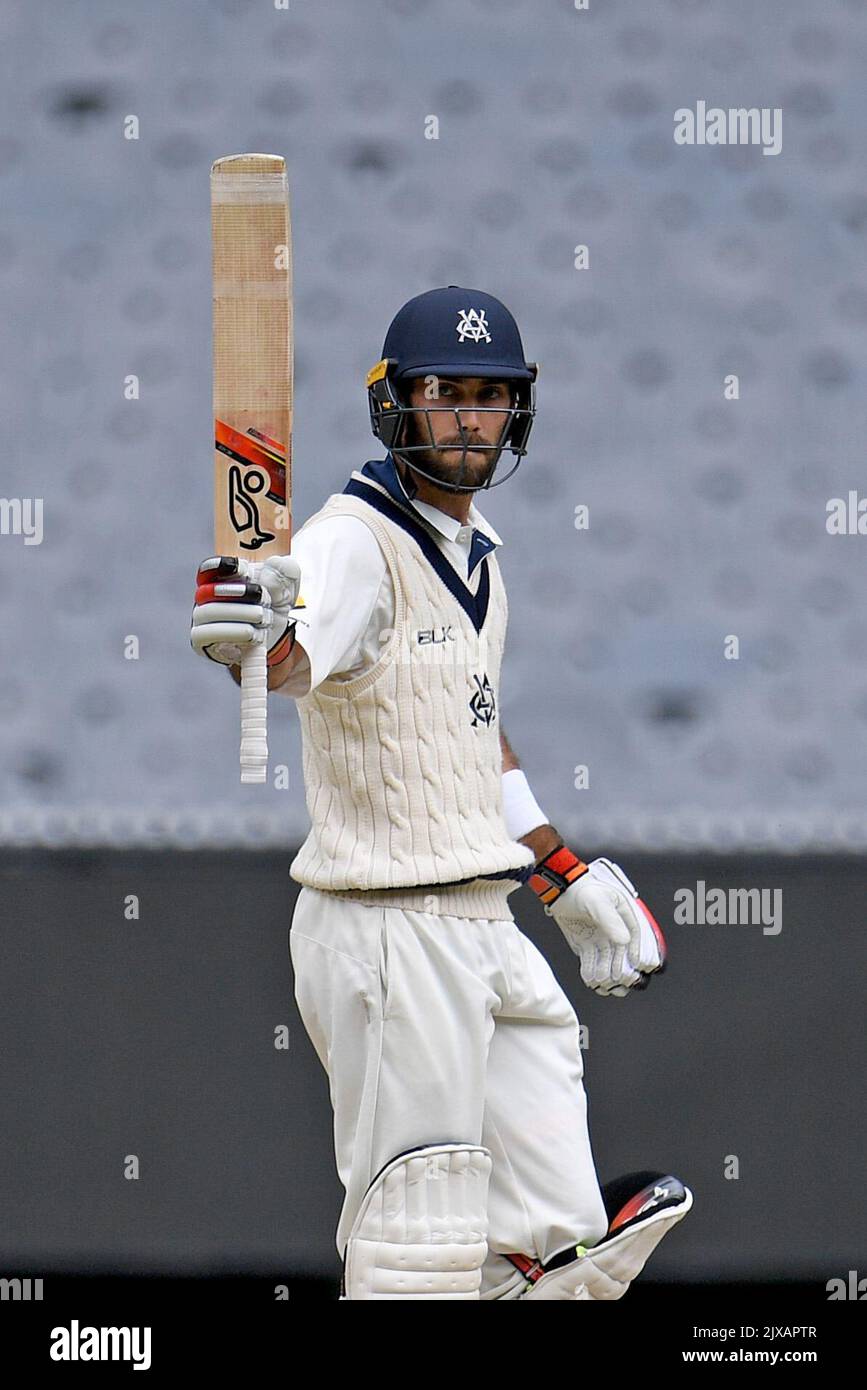 Batsman Glenn Maxwell of the Bushrangers raises his bat after reaching ...