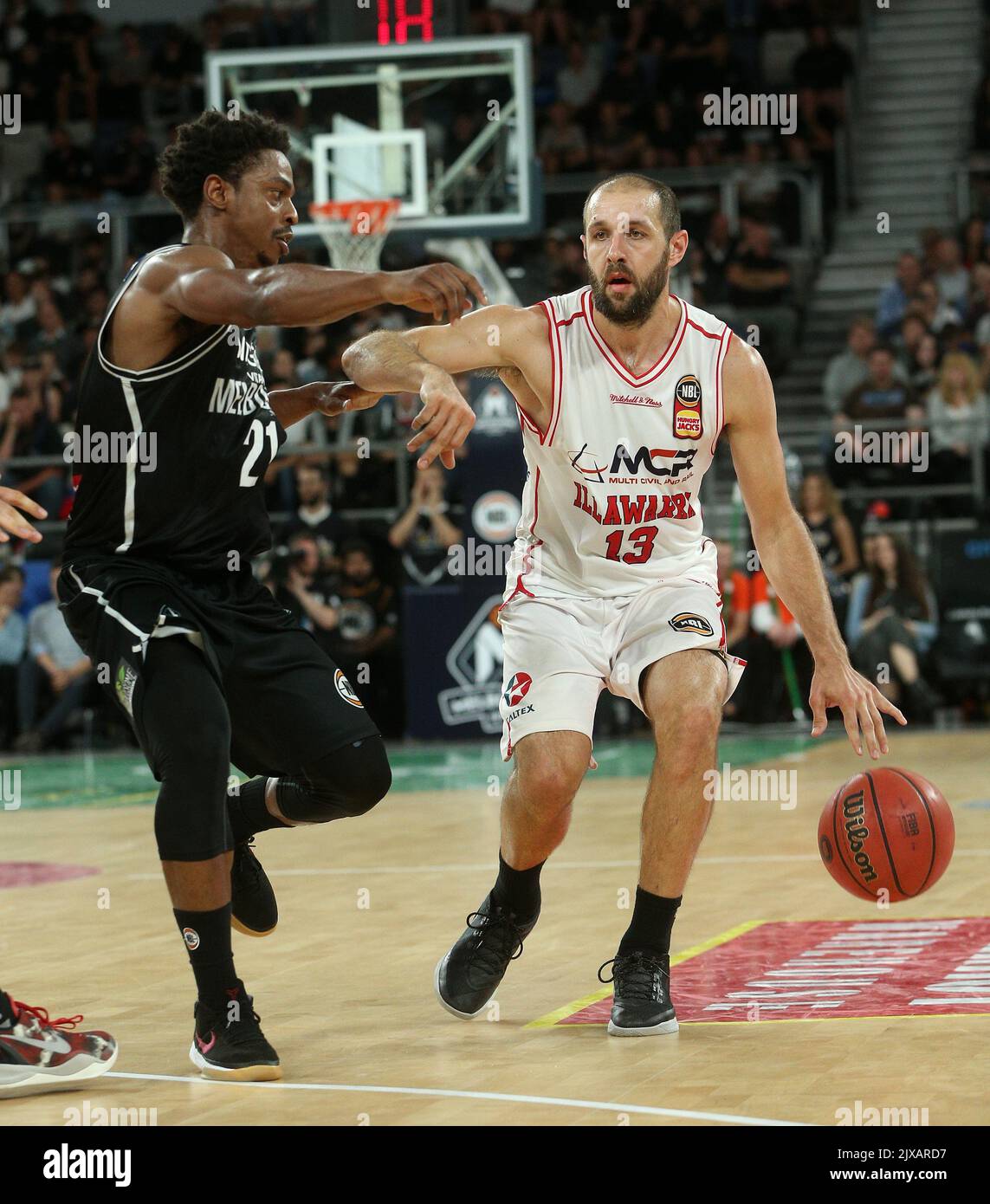 Rhys Martin of Illawarra is guarded by Casper Ware of Melbourne during ...