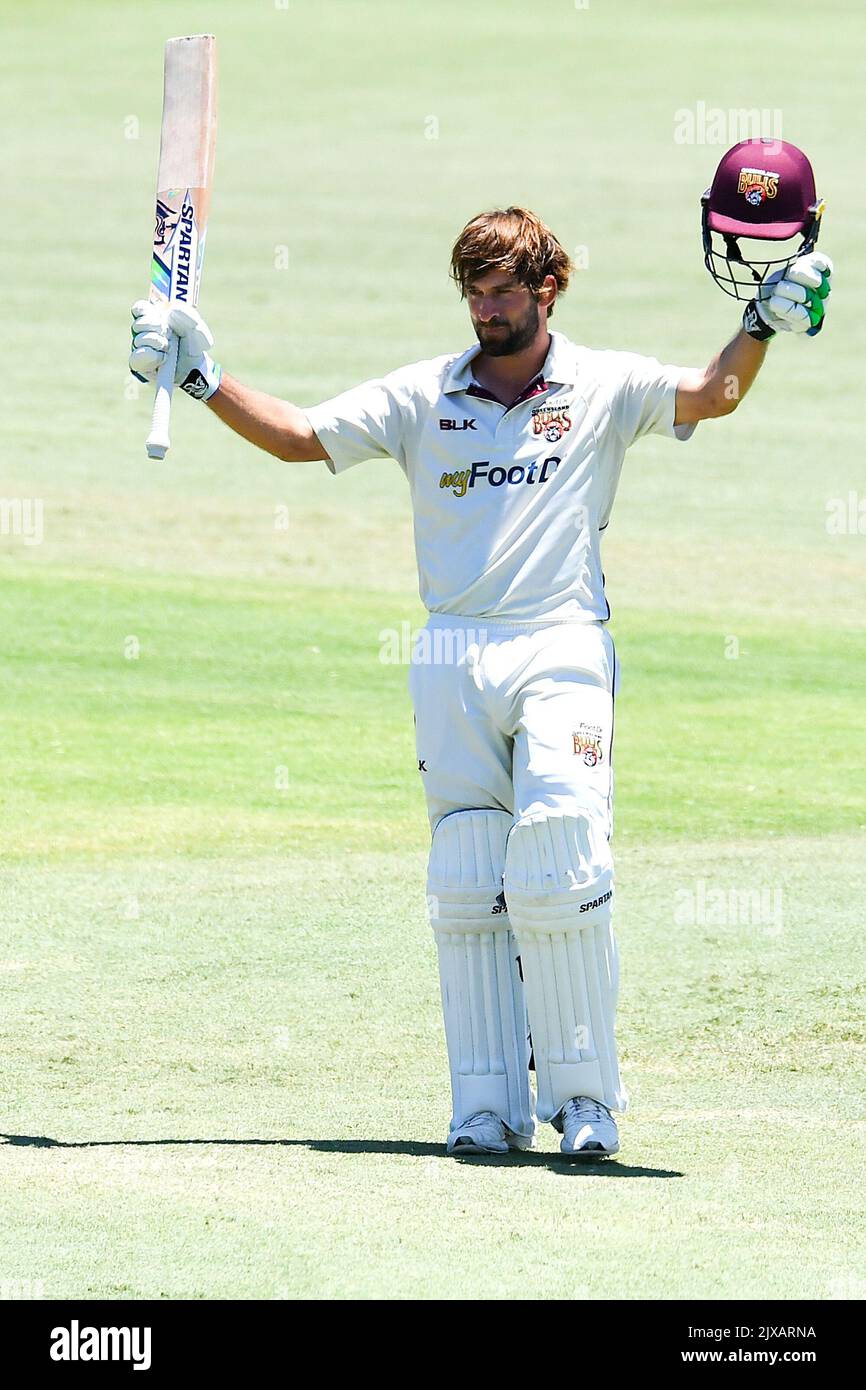 Joe Burns of Queensland celebrates after reaching a century during day ...