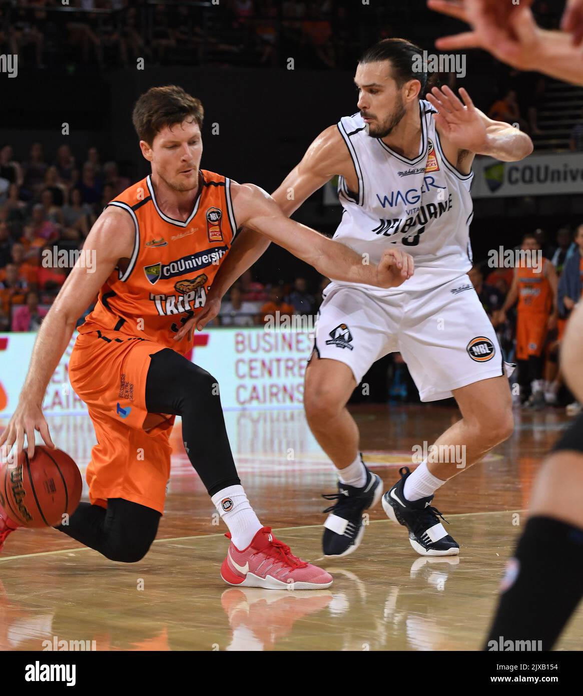 Cameron Gliddon of the Taipans (left) battles with Chris Goulding of ...