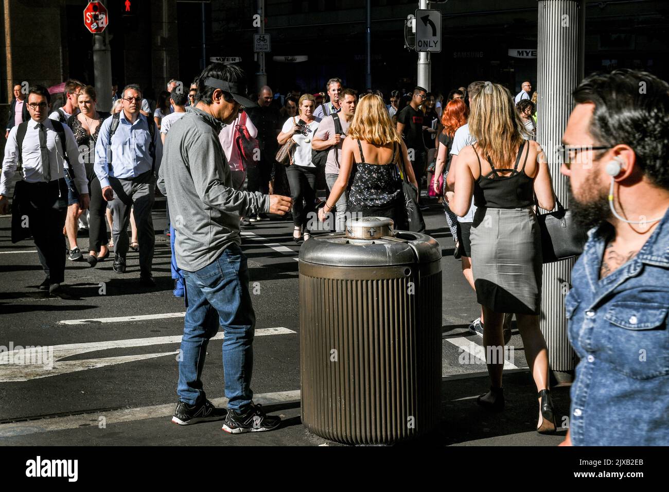 A stock image of a man smoking a cigarette on Market street in Sydney ...