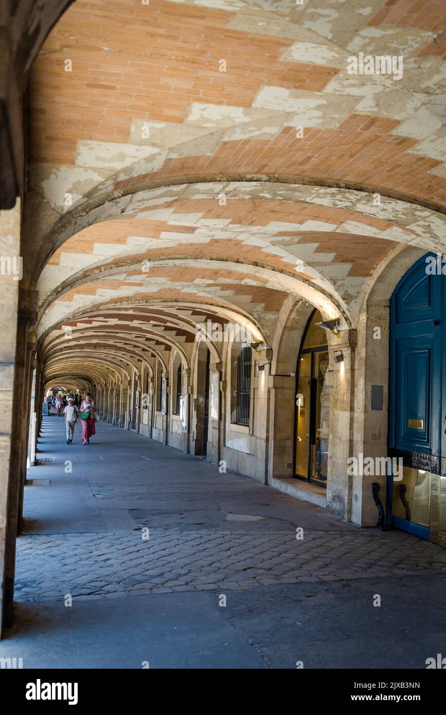 Arcades of the Place des Vosges, the oldest planned square in Paris ...