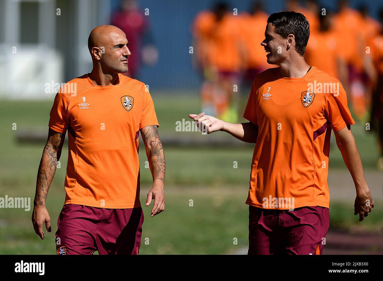 Thomas Kristensen speaks to Massimo Maccarone during a Brisbane Roar ...