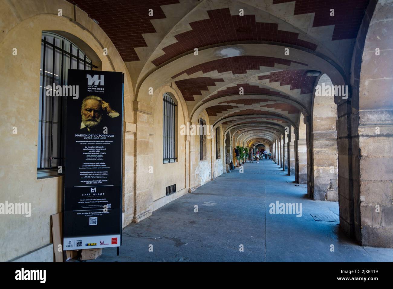 Arcades of the Place des Vosges, the oldest planned square in Paris ...