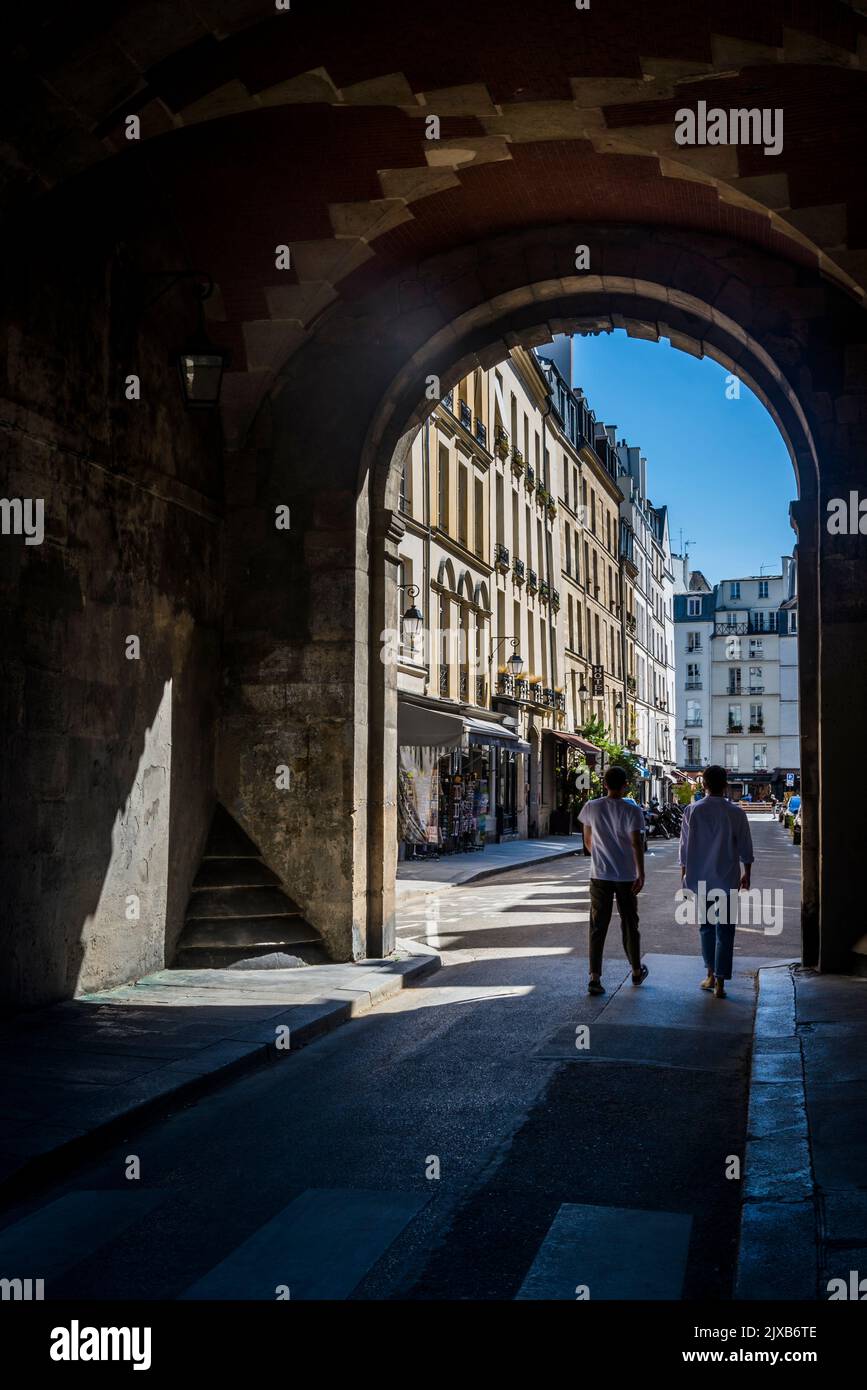 Arch leading from the Place des Vosges, the oldest planned square in ...