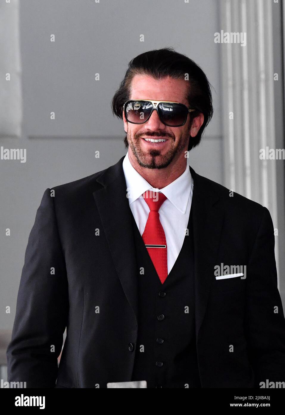 Travers Beynon, also known as "The Candyman", ls seen in a cafe ...