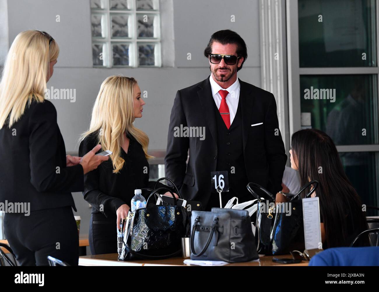Travers Beynon (centre), also known as "The Candyman", ls seen in a ...