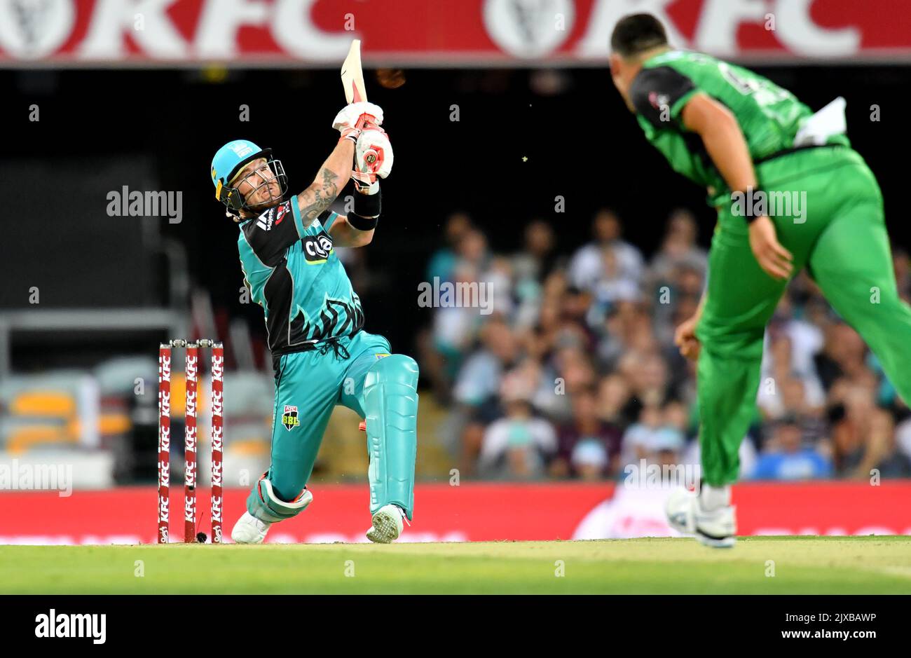 Brendon McCullum (left) of the Heat hits six runs off the bowling of ...