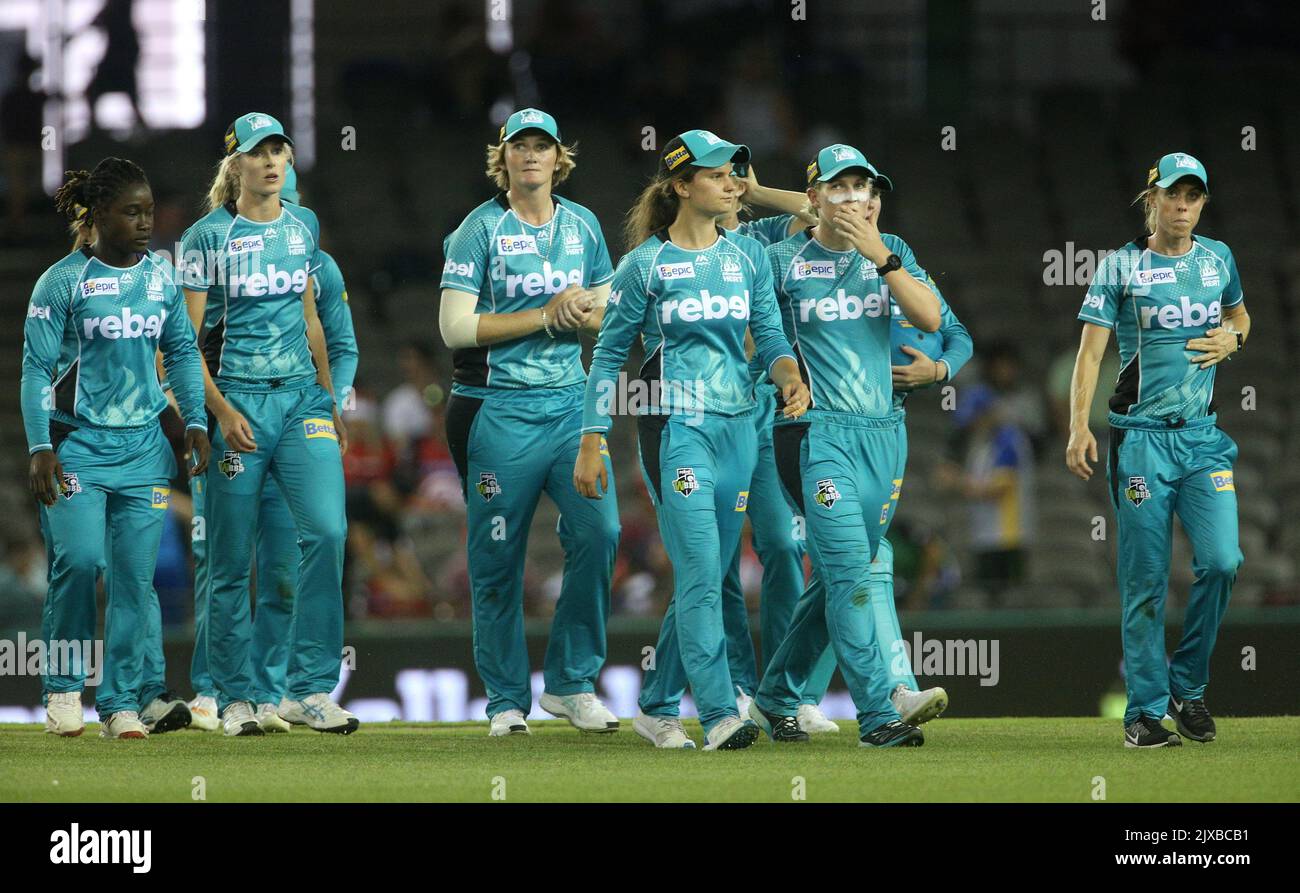 The Brisbane Heat team leave the field after their 10 wicket loss ...