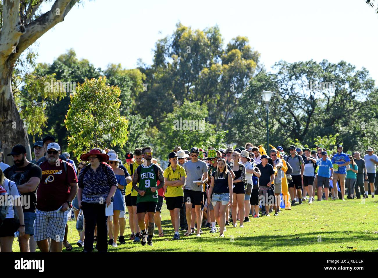 Cricket fans line up to enter the MCG for the start of Day One of the ...