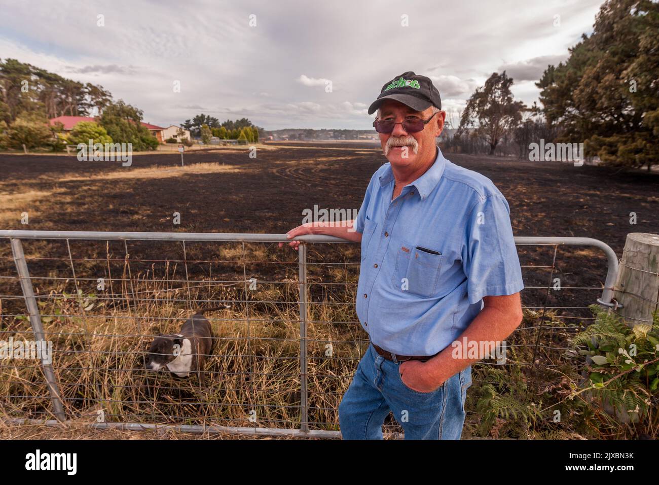 Robert Bannon poses for a photograph after a bushfire burned through ...