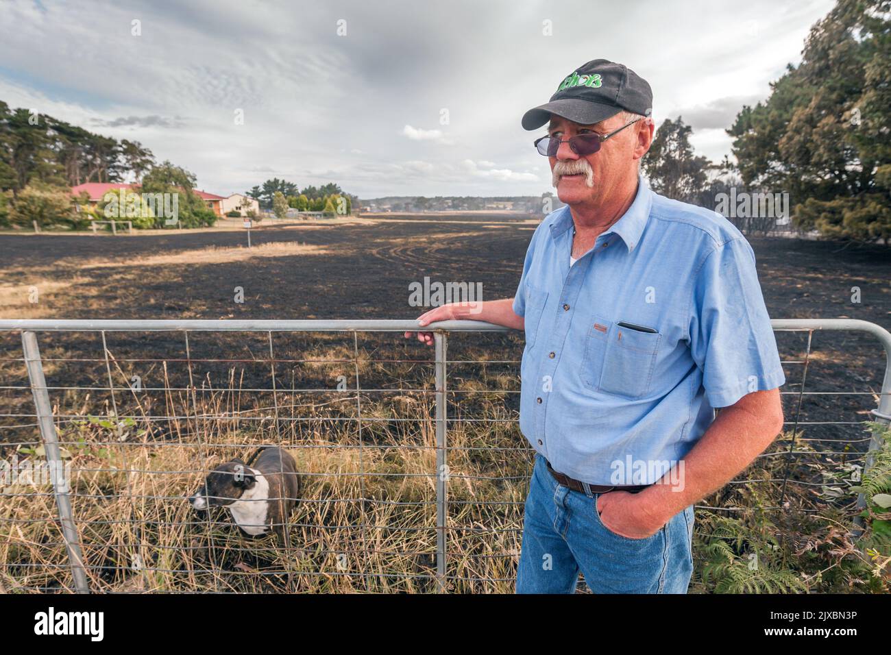 Robert Bannon poses for a photograph after a bushfire burned through ...
