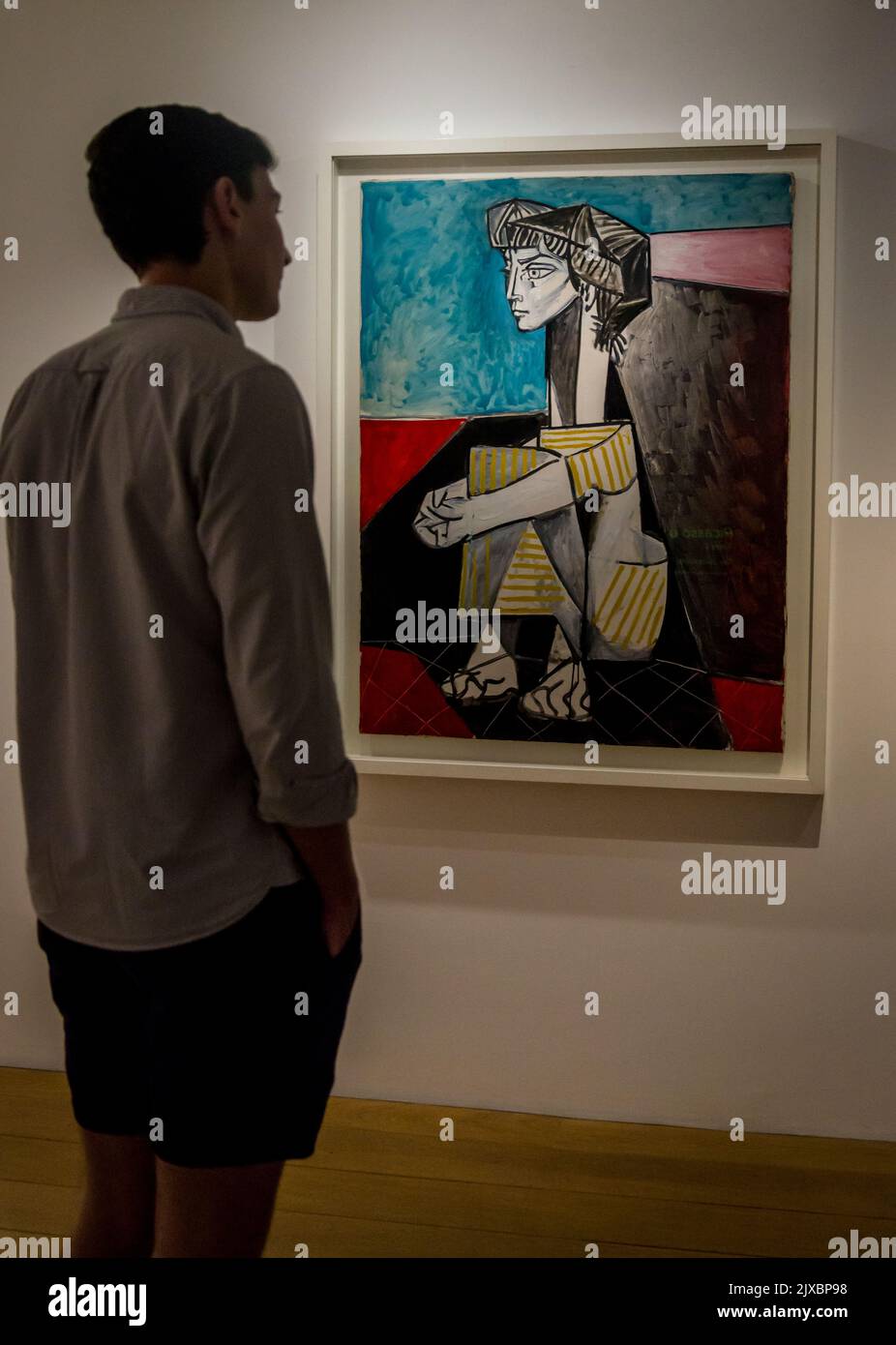 'Man looking at Portrait of Jacqueline Roque with her hands crossed ...