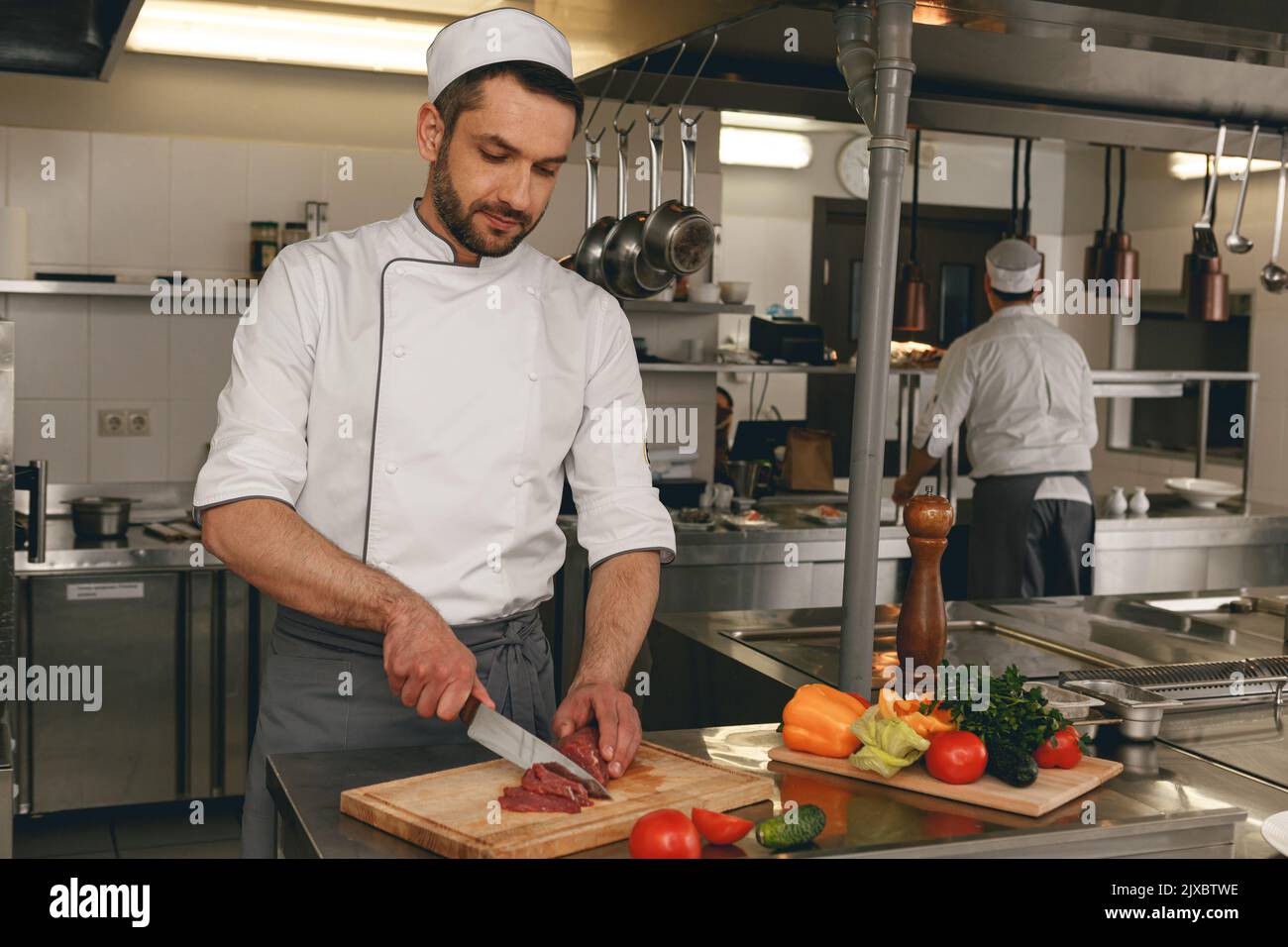 Hands cutting fresh meat on hi-res stock photography and images - Alamy