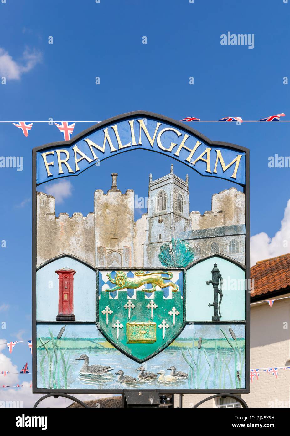 Town sign, Framlingham, Suffolk, England, UK blue sky with bunting ...