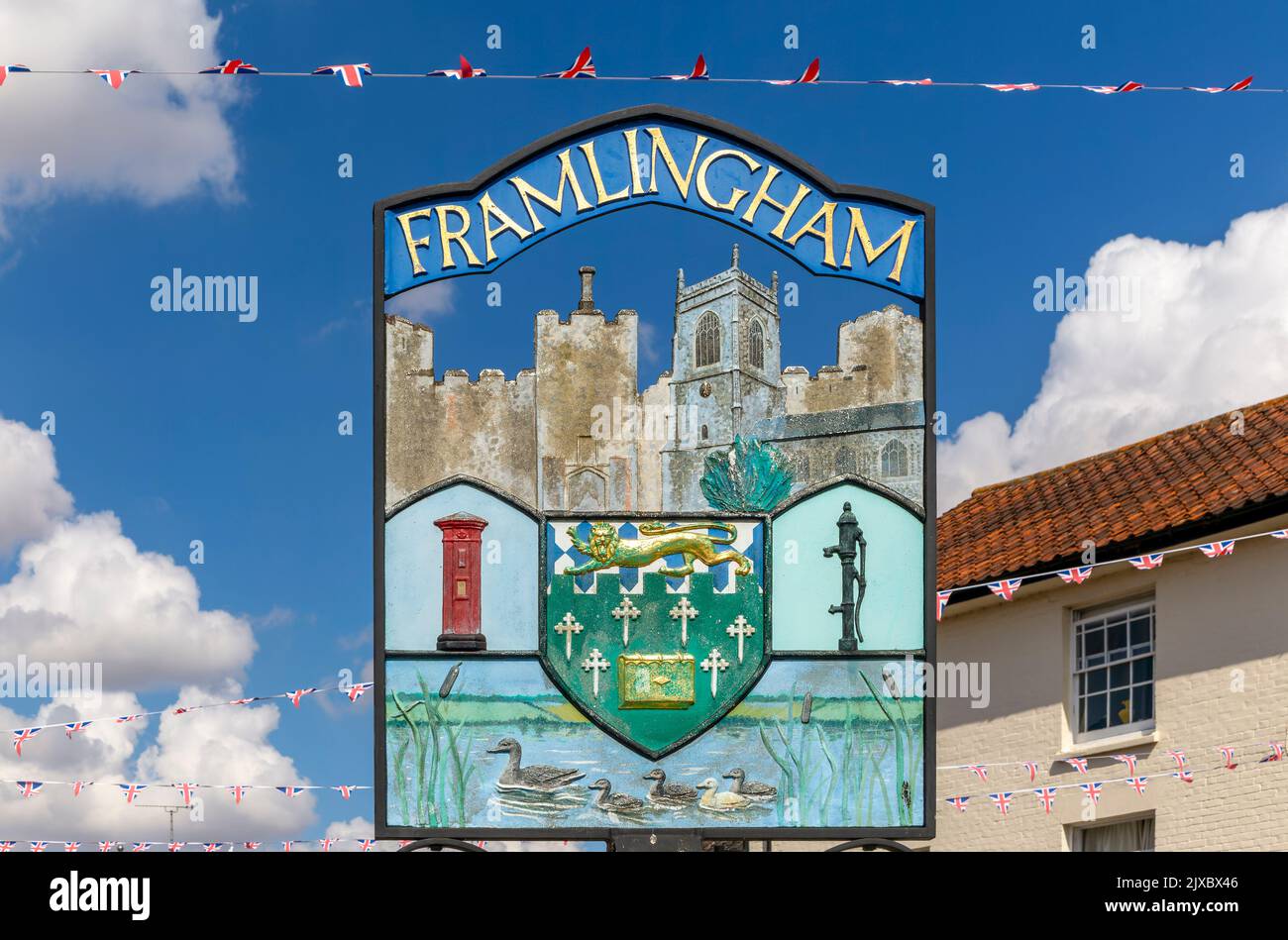 Town sign, Framlingham, Suffolk, England, UK blue sky with bunting ...