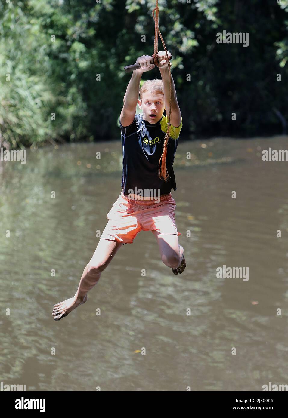 Josh Ford swings into the water to cool off at the Bunya Crossing ...