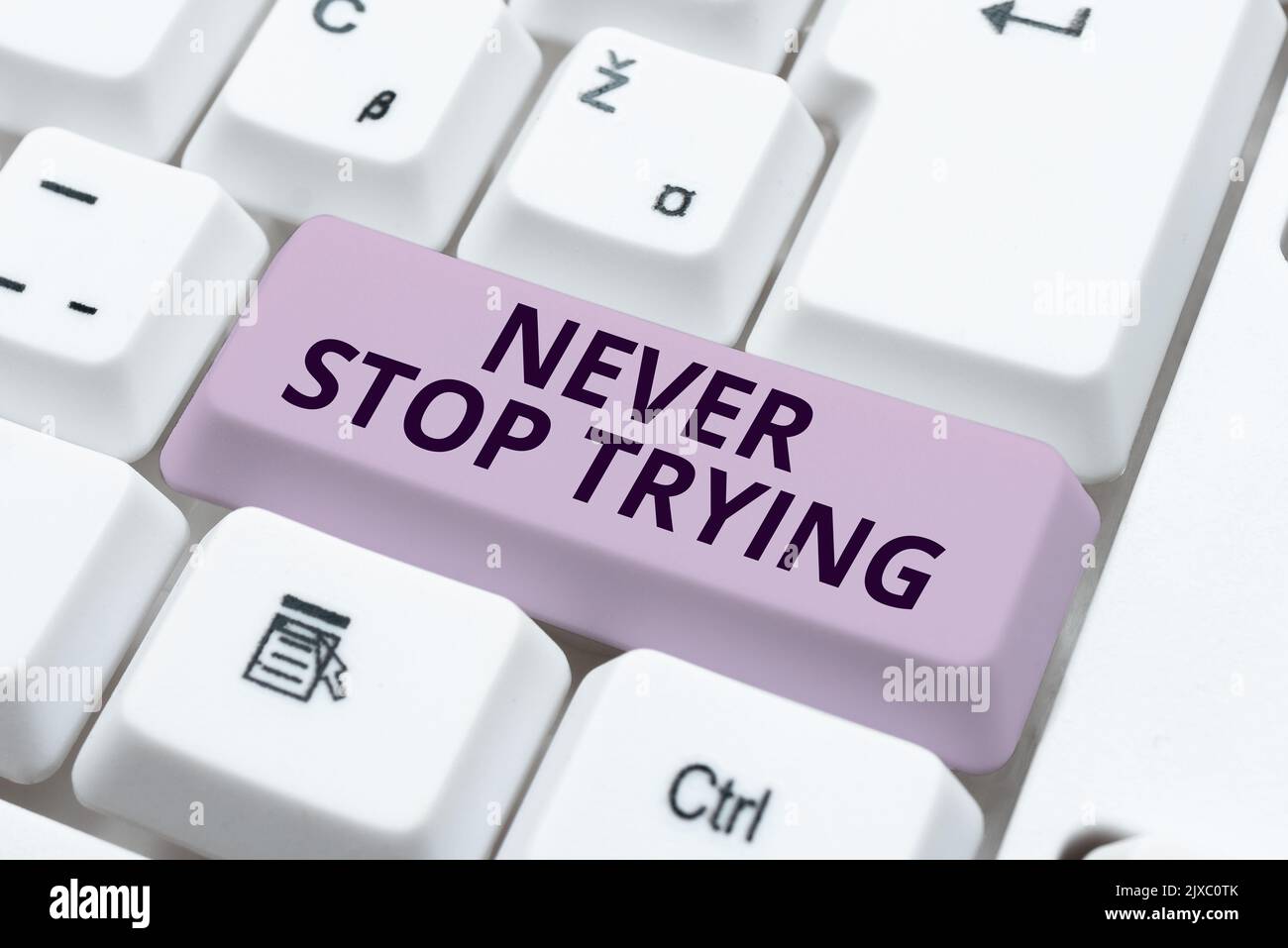 Sign displaying Never Stop TryingDo not give up Continue to Try Again ...
