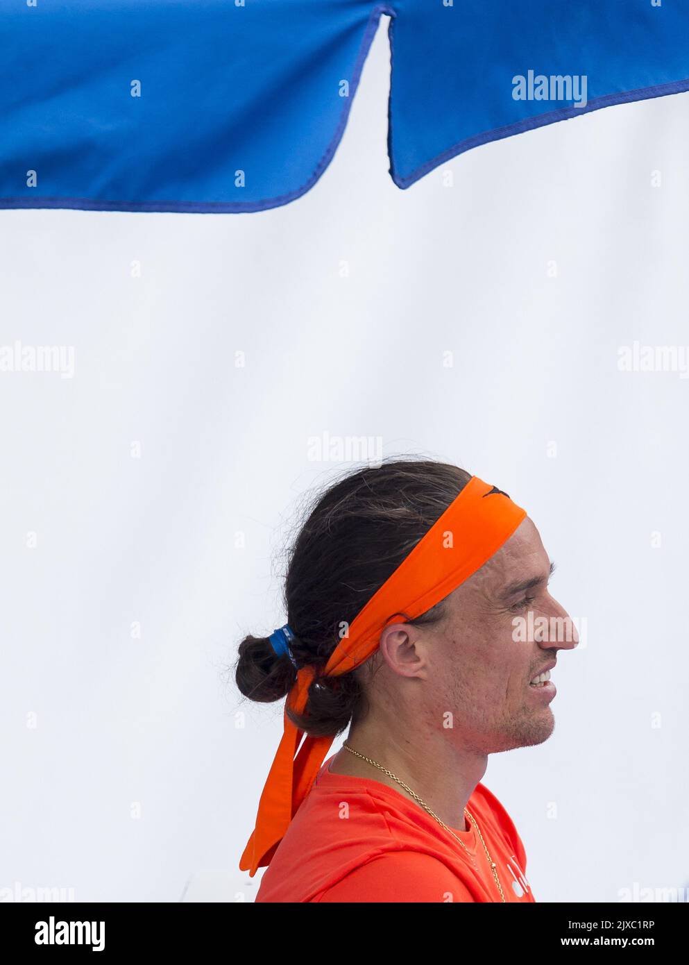 Alexandr Dolgopolov of the Ukraine between games against Fabio Fognini ...