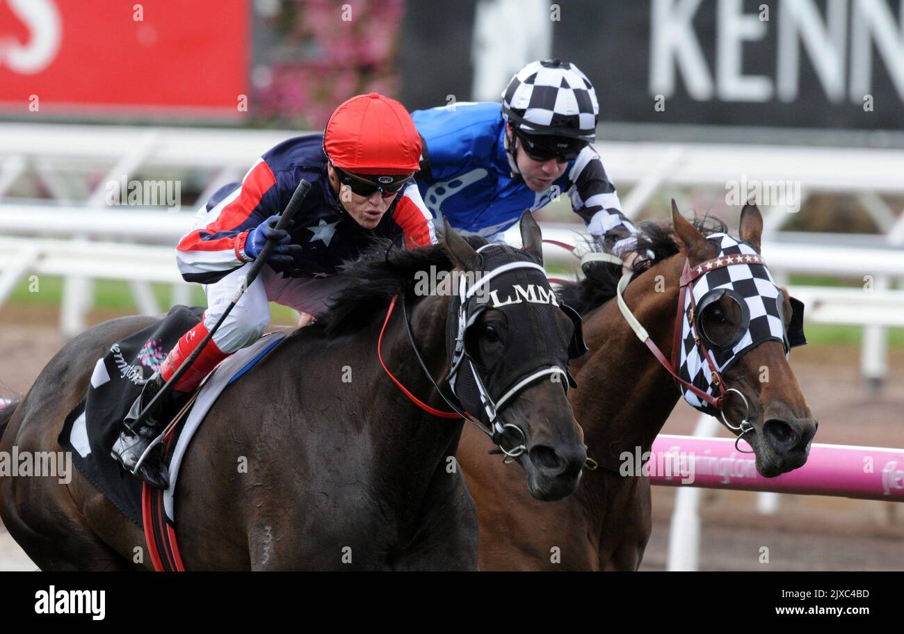 Jockey Craig Williams rides Pretty Punk (left) to victory in Race 2 ...