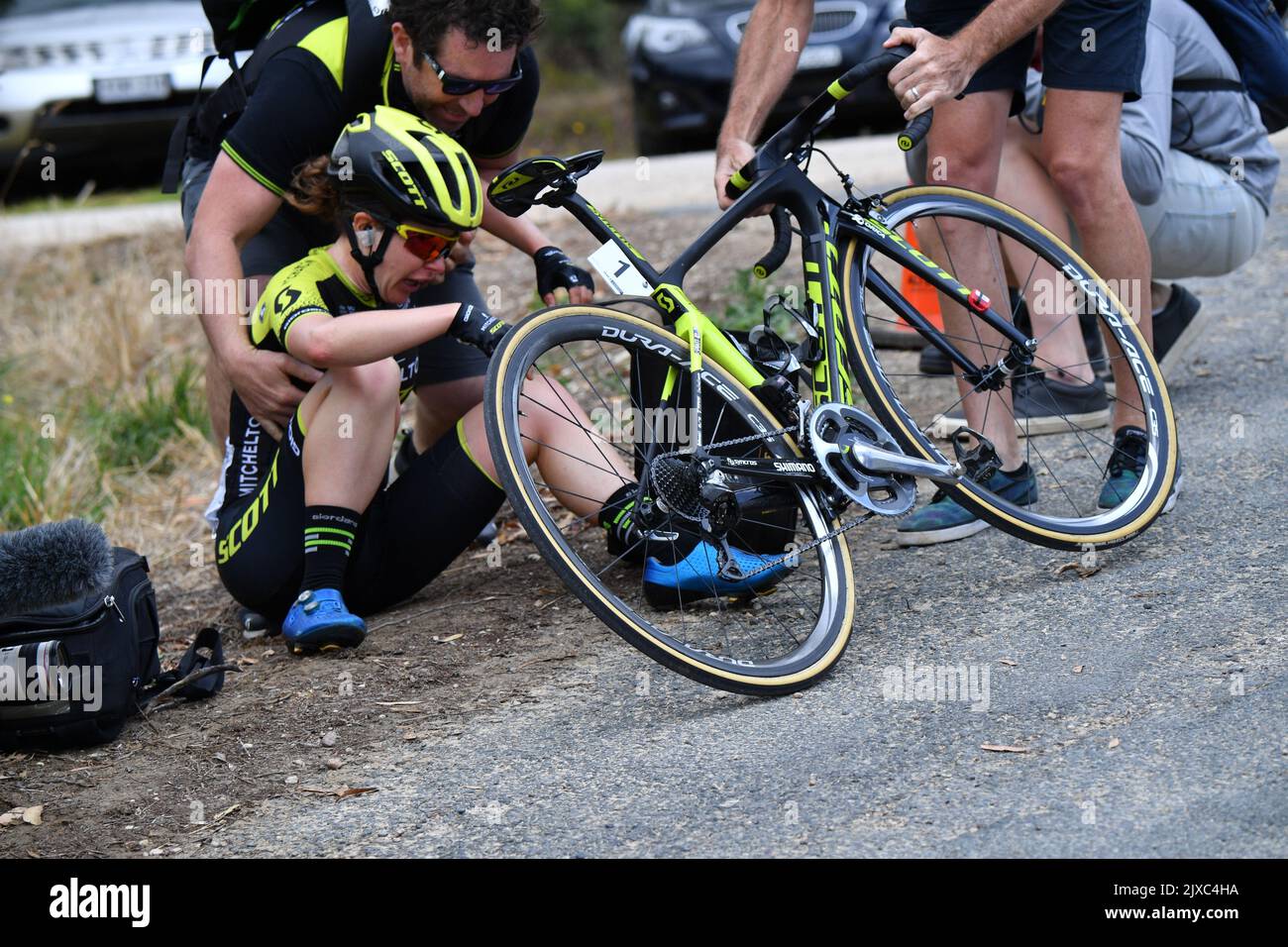 Amanda Spratt (Michelton Scott) is seen being helped by her team ...