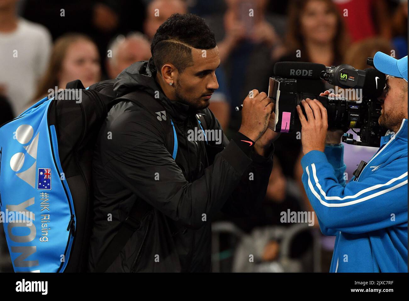 Nick Kyrgios of Australia signs a television camera after defeating ...