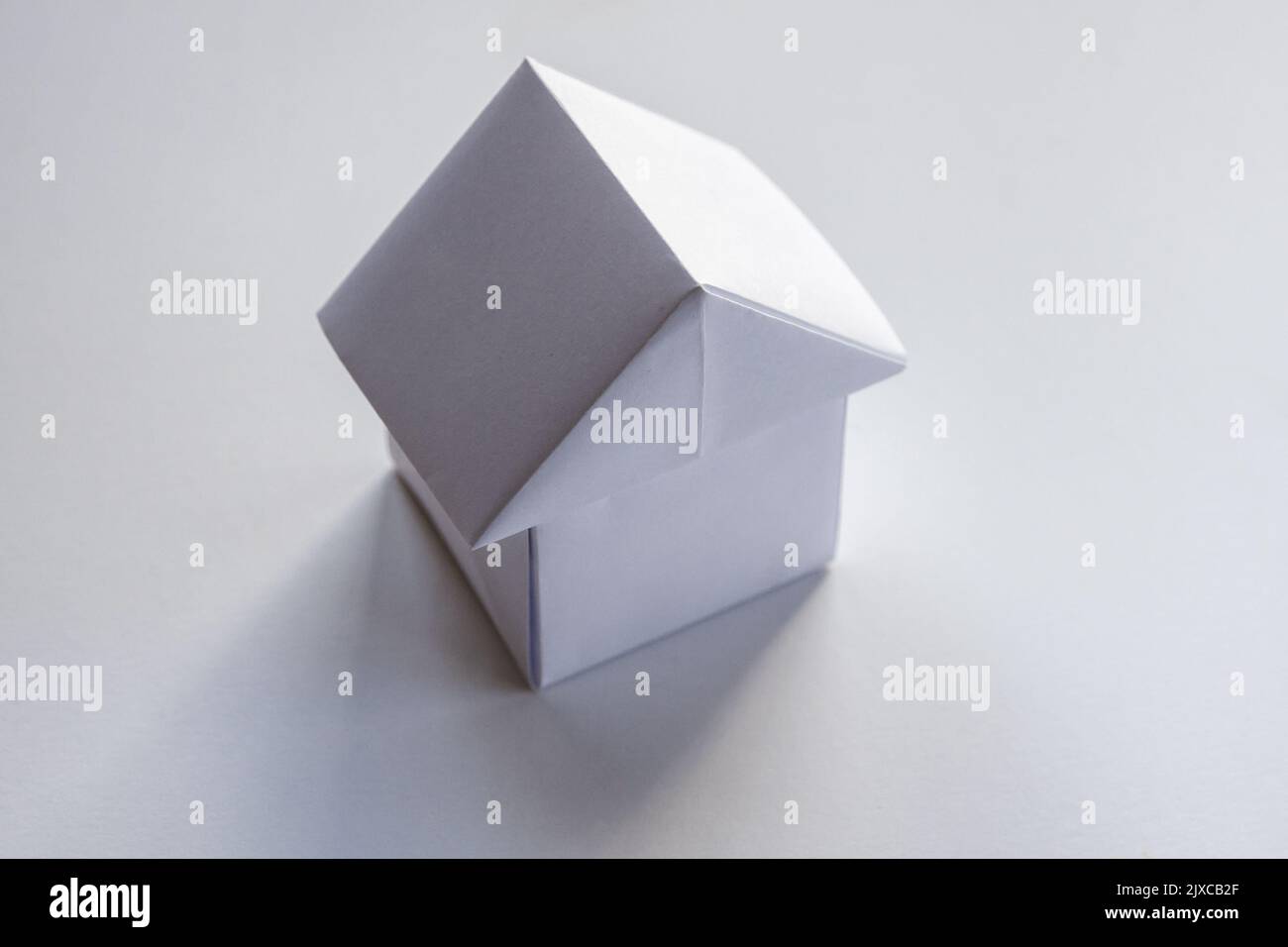 Paper house origami isolated on a blank white background Stock Photo ...