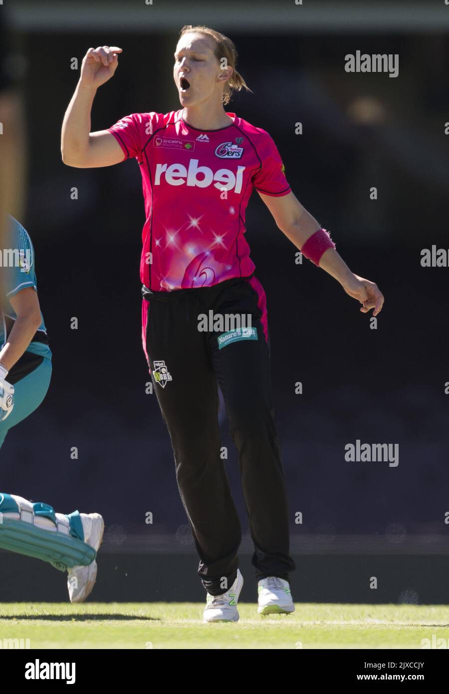 Sarah Aley of the Sixers appeals successfully for a wicket during the ...