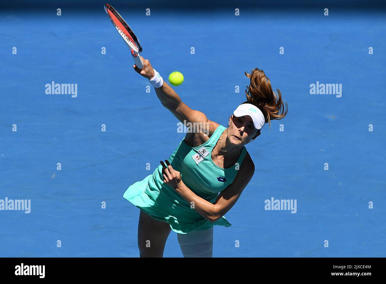 Alize Cornet of France in action against Elise Mertens of Belgium ...