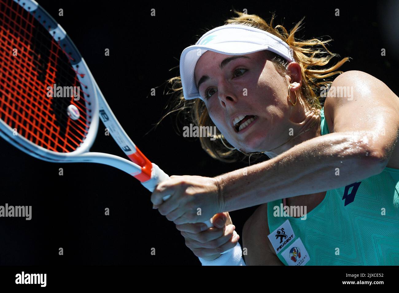 Alize Cornet of France in action against Elise Mertens of Belgium ...